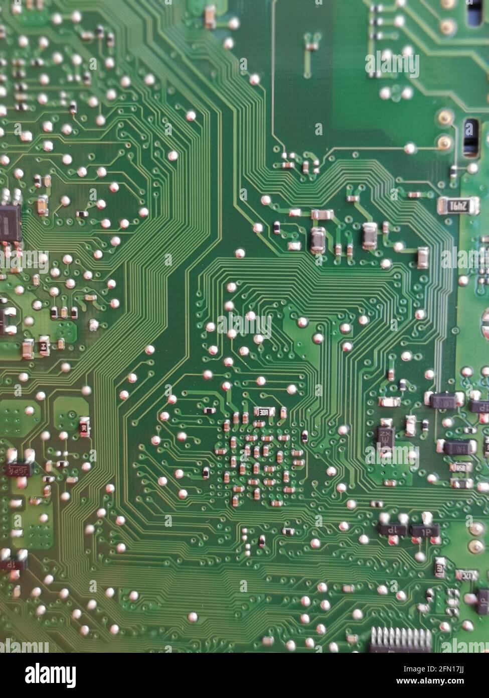 Closeup of a computer's green printed circuit board Stock Photo - Alamy