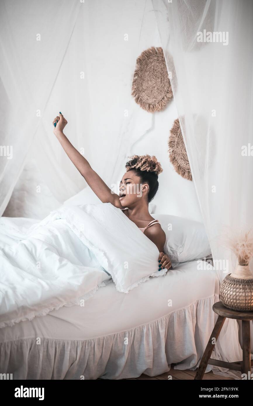 Woman stretching yawning waking up hi-res stock photography and images ...