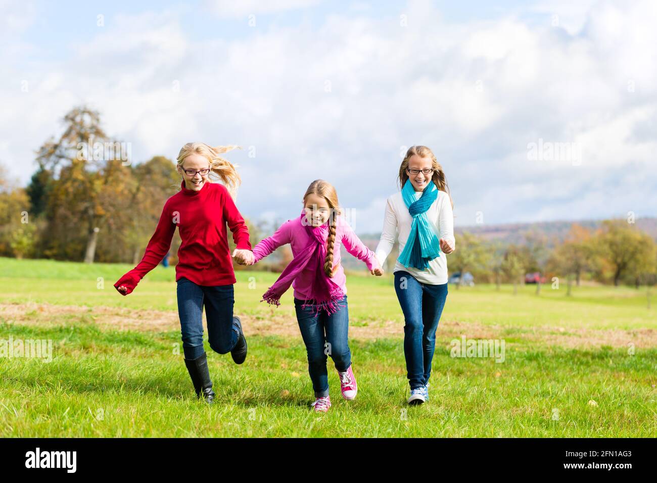 Kids running through the field hi-res stock photography and images - Alamy