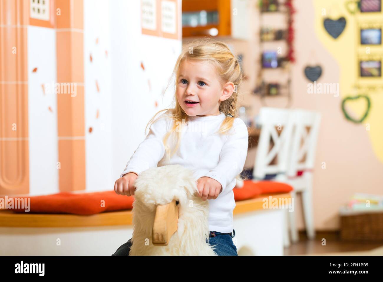 Female kid playing in living hi-res stock photography and images - Alamy