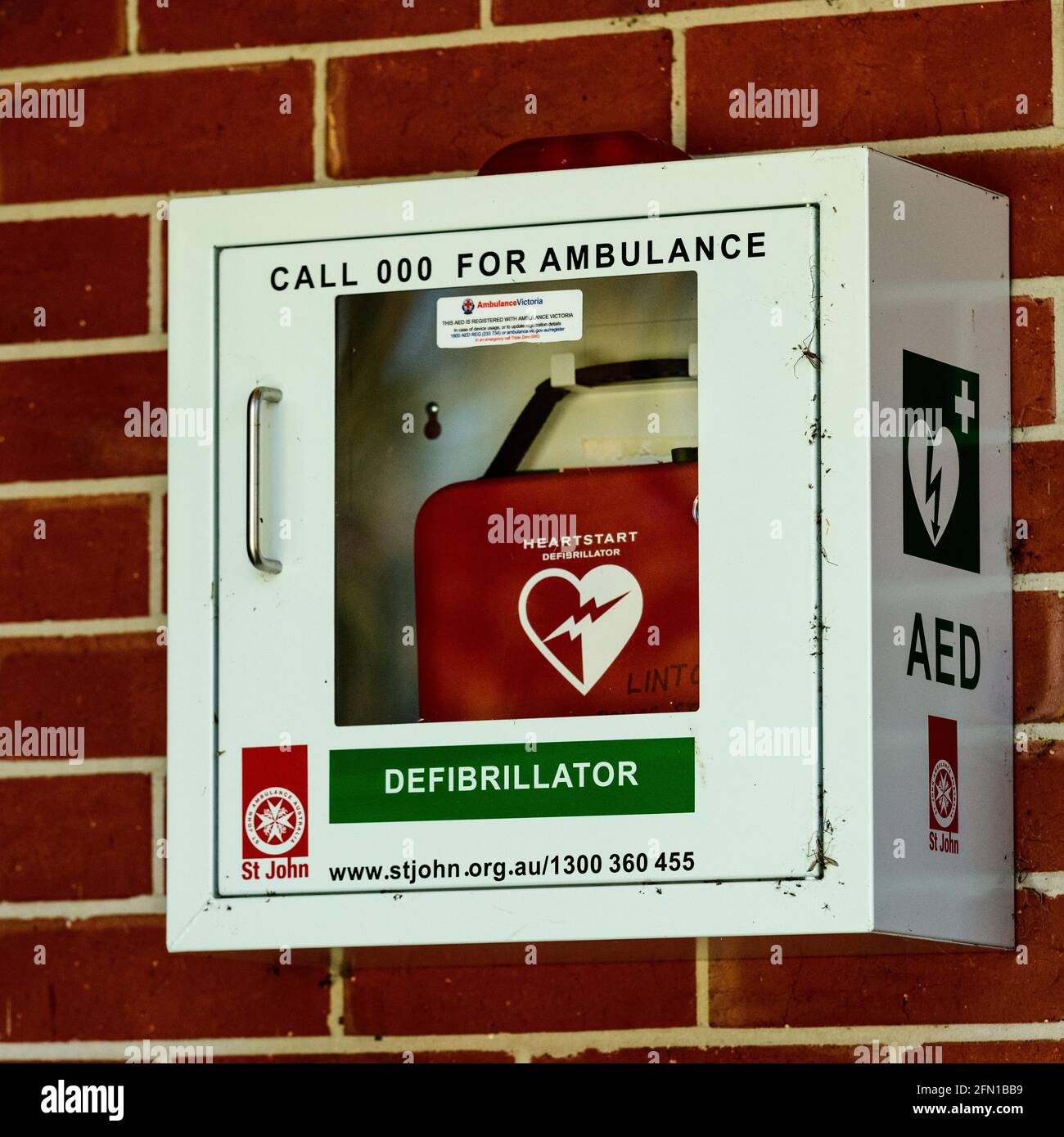 Portable emergency Heart Defibrillator mounted in the entrance of a ...