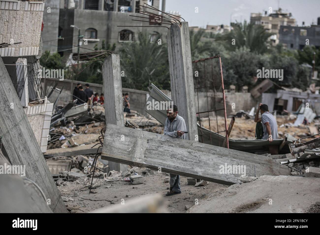 Beit Lahia, Palestinian Territories. 13th May, 2021. People stand on ...