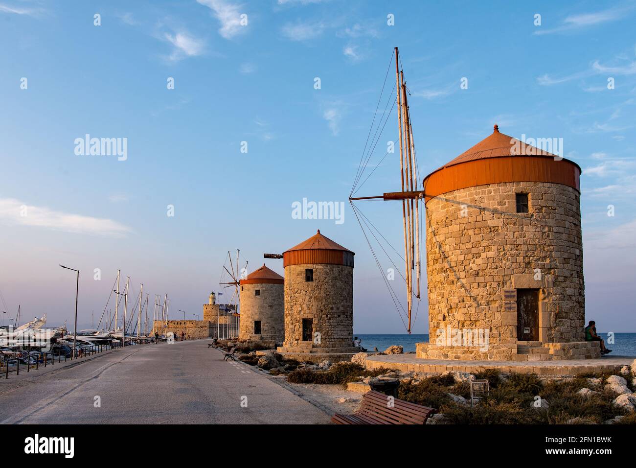 Windmills in the port of Rhodes Stock Photo - Alamy