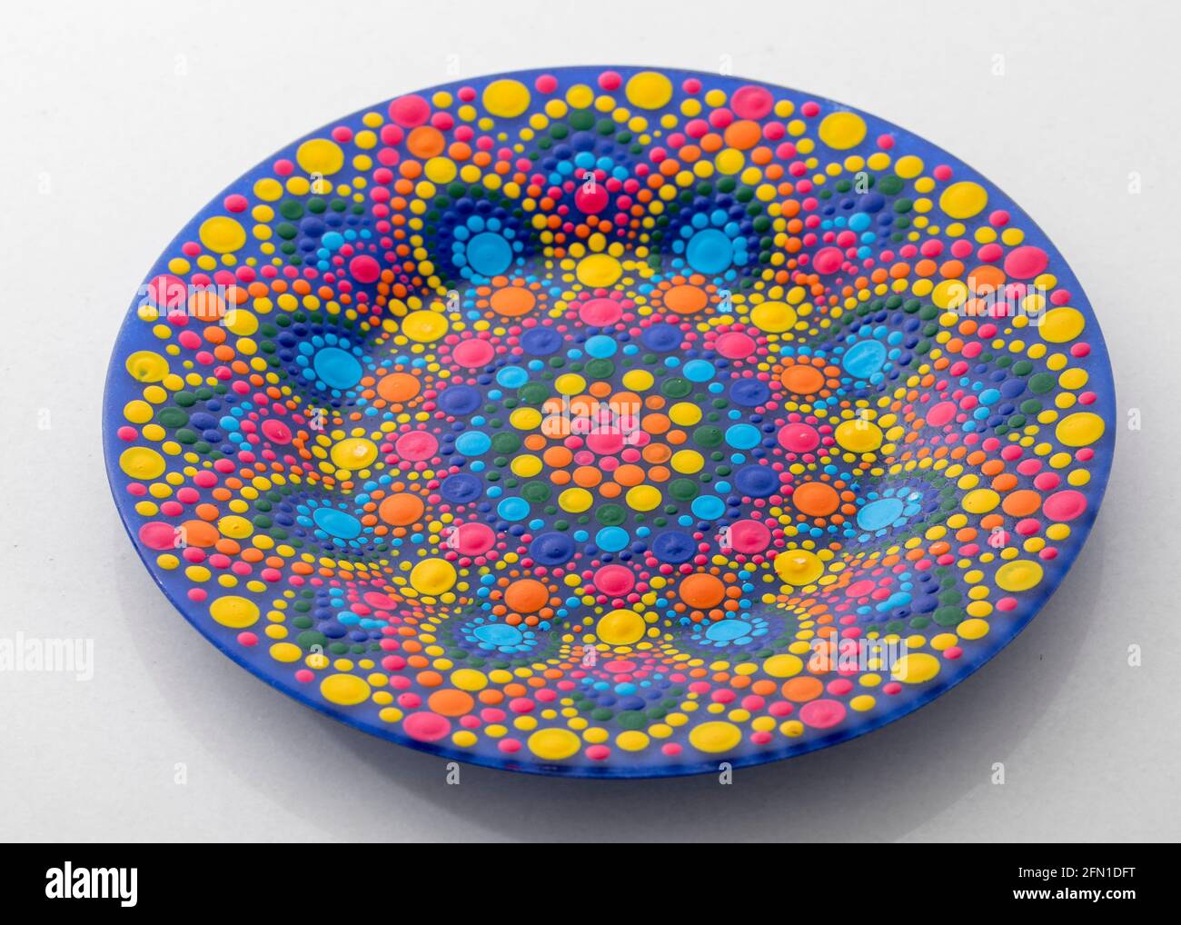 Pink decorative plate with a pattern in the style of a mandala Stock ...