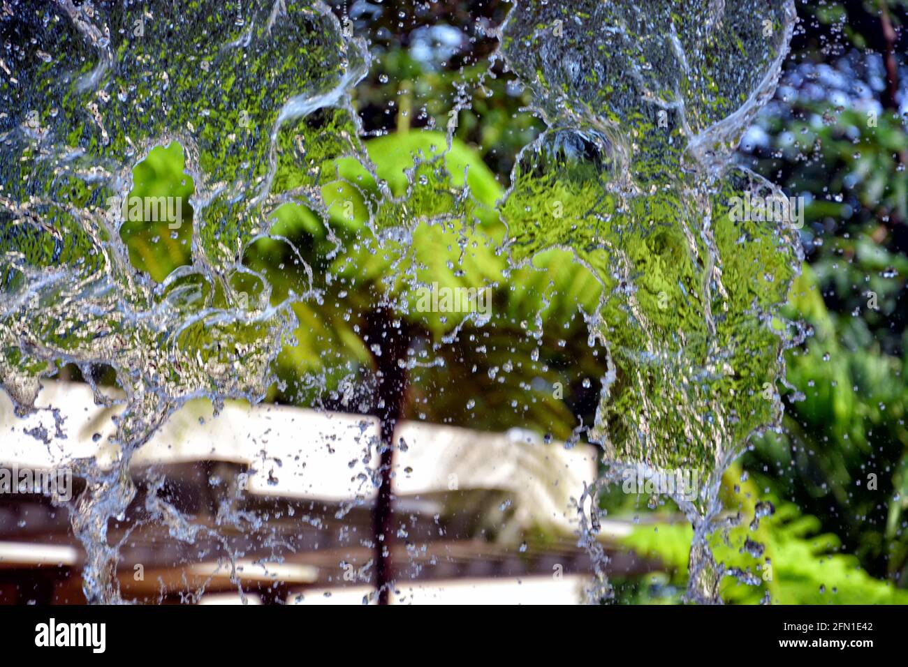 Moment of water spilling from small waterfall, Puerto Rico Stock Photo ...
