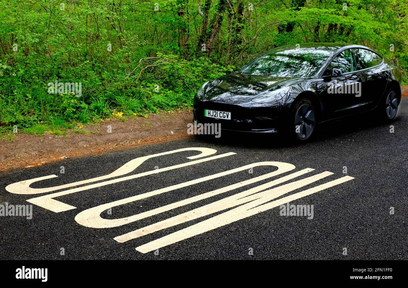 Tesla,Model 3,country road,slow,sign,Newtown,Isle of Wight,England,UK ...