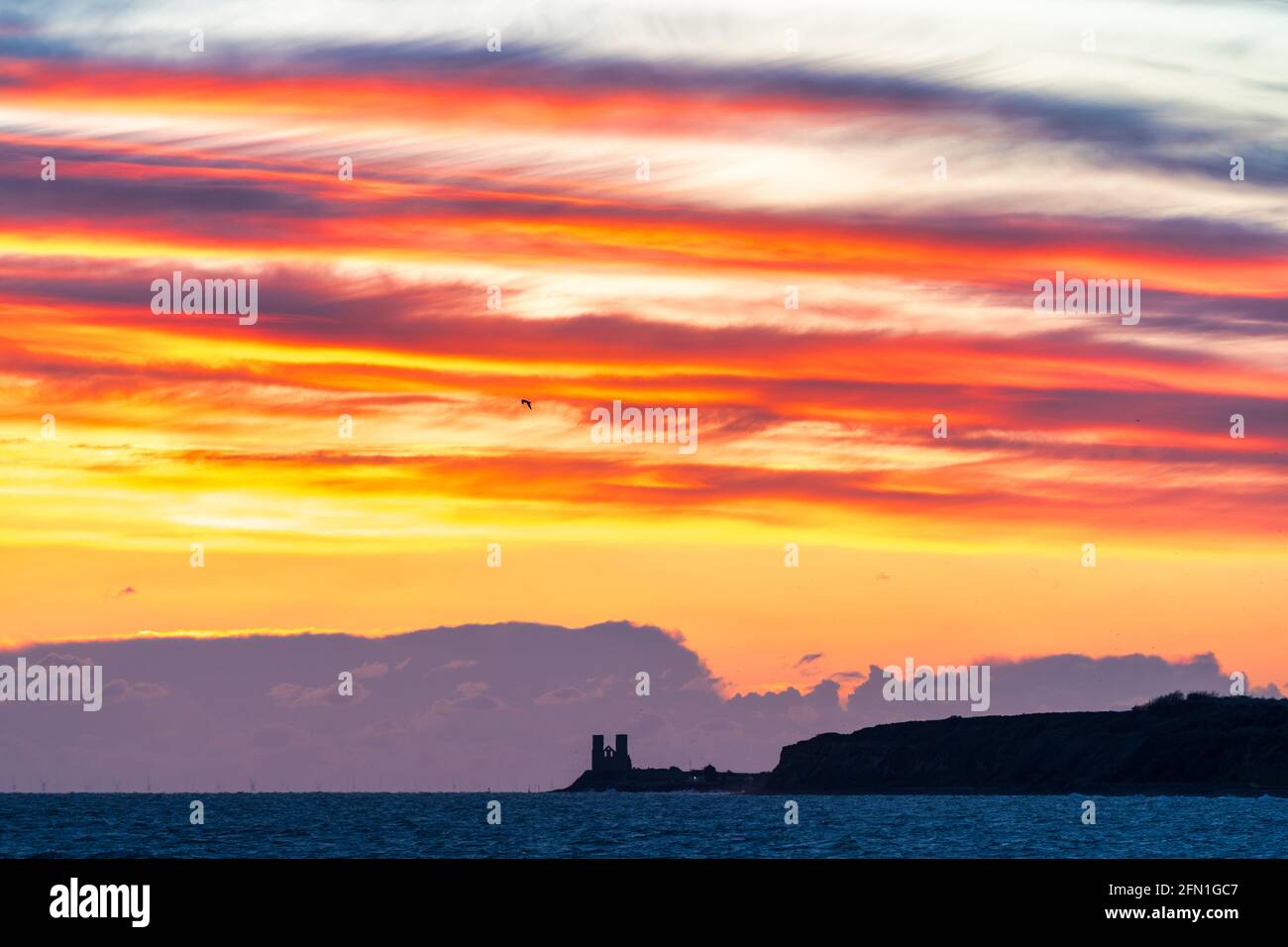 The Kent coast Reculver headland with the twin towers of the 12th ...