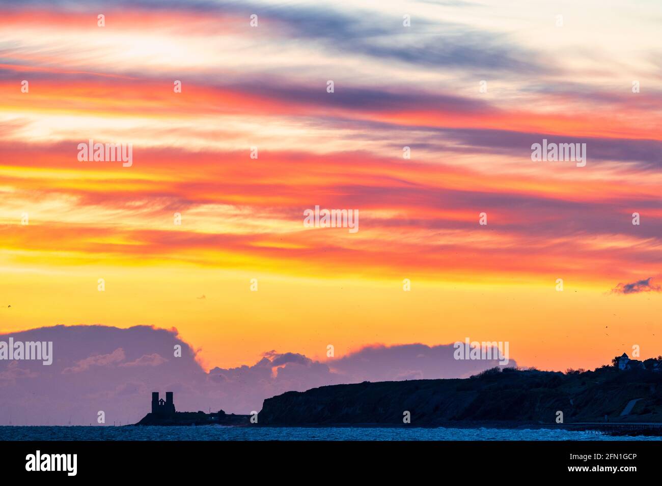 The Kent coast Reculver headland with the twin towers of the 12th ...