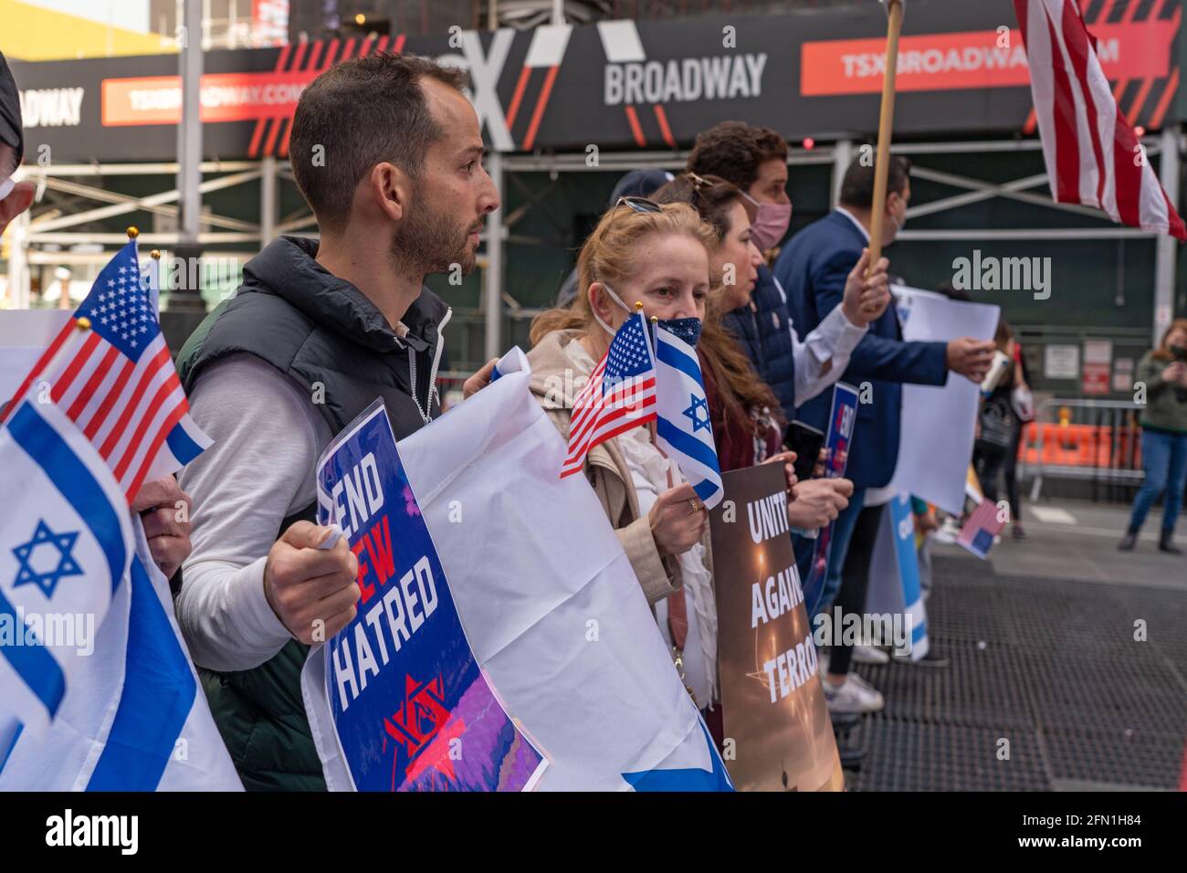 Pro-Israel supporters hold flags and placards as the Israeli-American ...