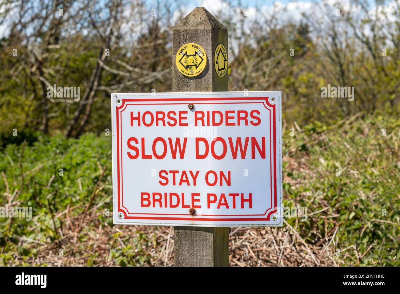 A rural sign saying Horse Riders slow down Stock Photo - Alamy