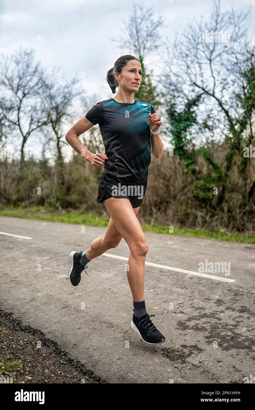 Girl running in nature, it is her healthy and free lifestyle Stock ...