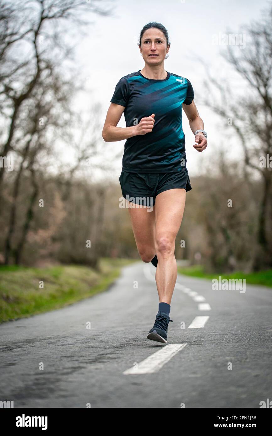 Girl running in nature, it is her healthy and free lifestyle Stock ...