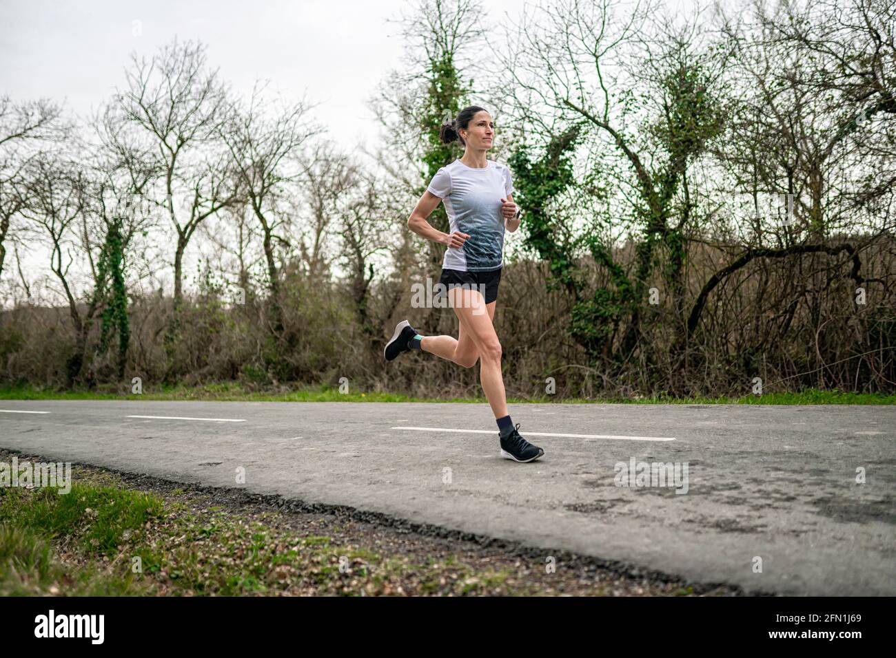 Girl running in nature, it is her healthy and free lifestyle Stock ...