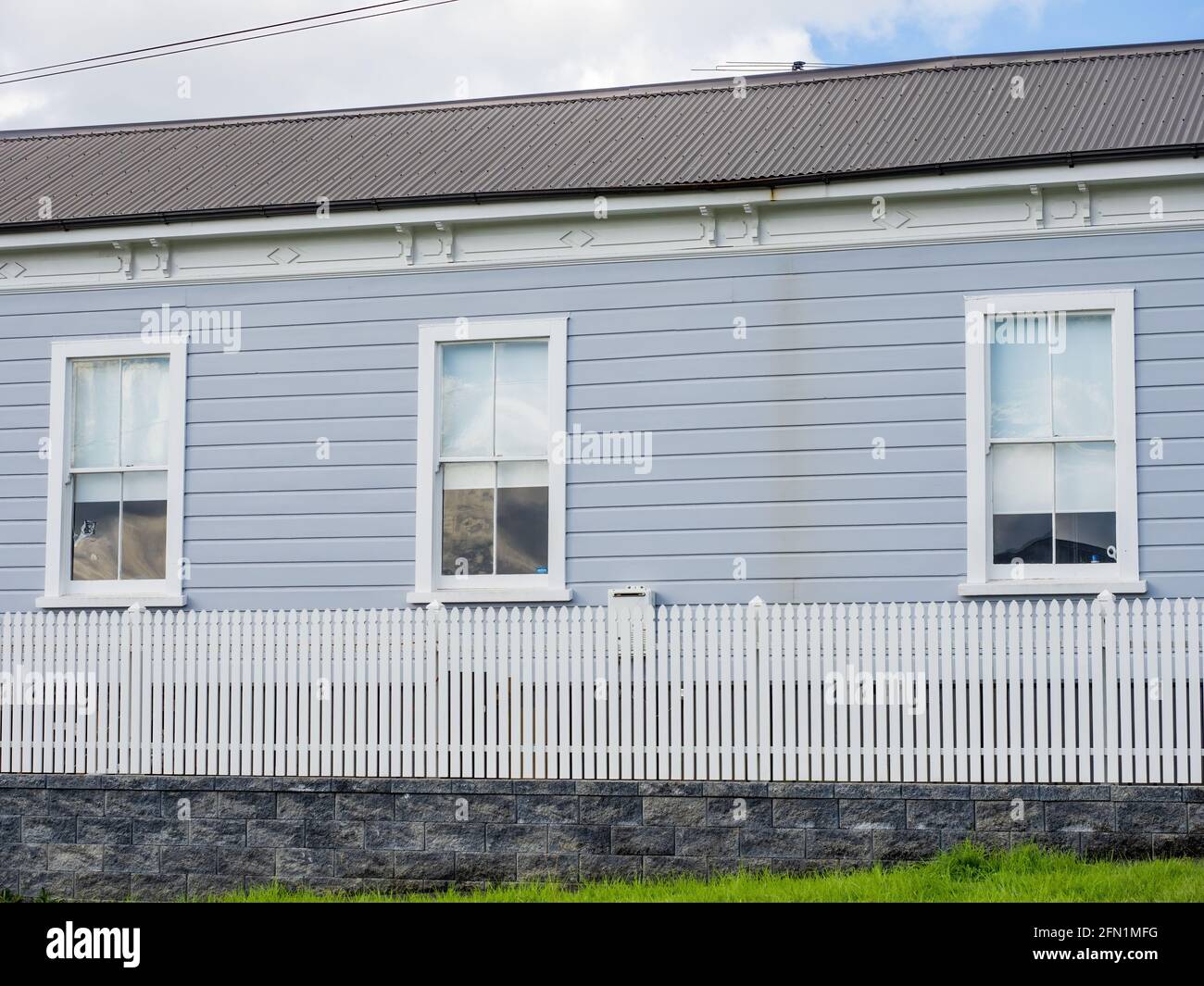 windows on timer weatherboard wall Stock Photo - Alamy