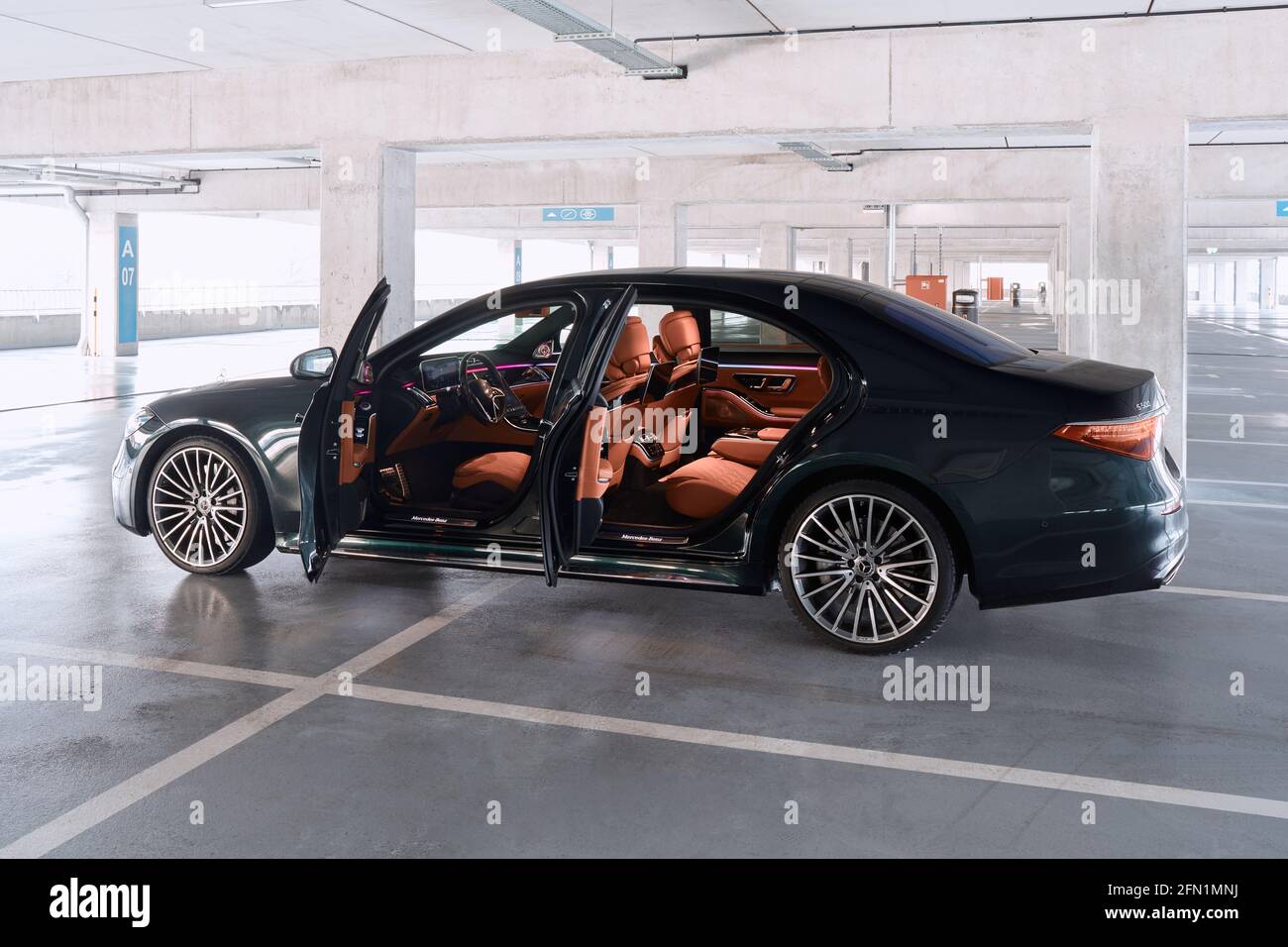 Luxurious Mercedes S Class with open doors, standing on an underground ...