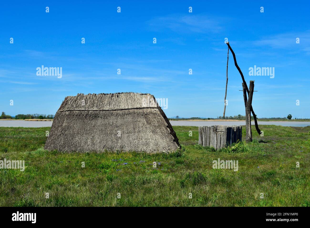 Austria, rest area with traditional old draw well and straw yurt on a ...