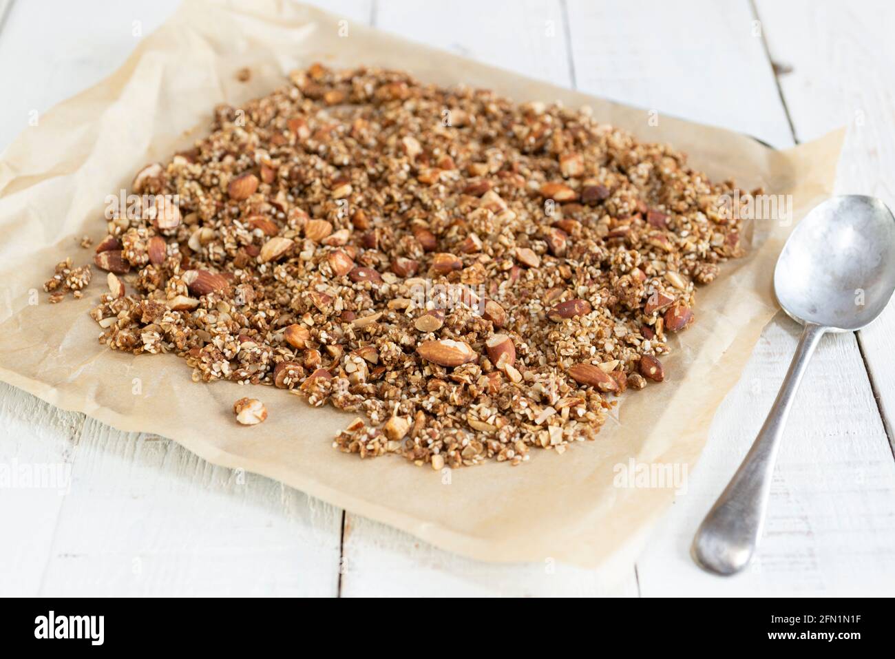 Granola topping made from baked oats, nuts and brown sugar Stock Photo ...