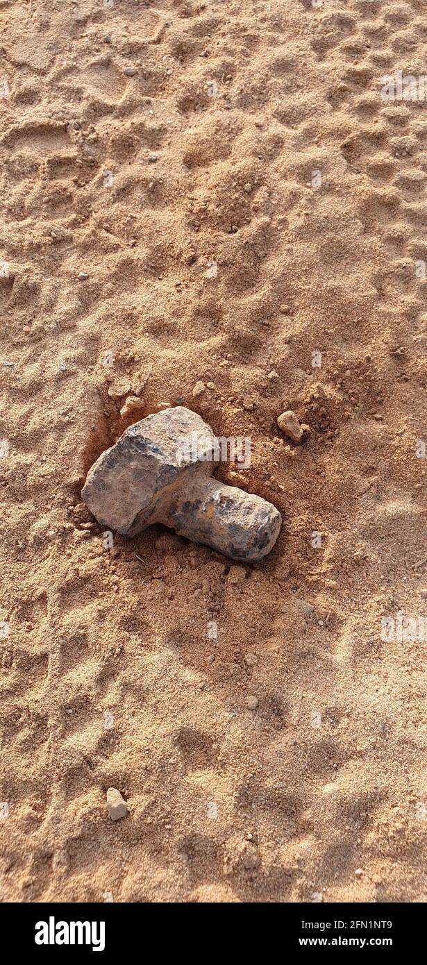 a rusty bolt lost in the sand Stock Photo - Alamy
