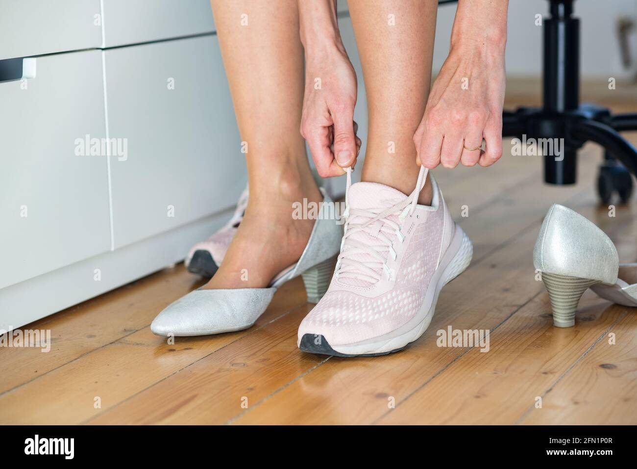 business woman changing to sports shoes Stock Photo - Alamy