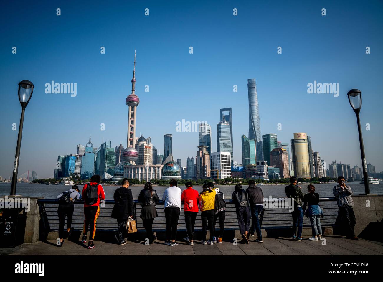 People surrounding shanghai skyline Stock Photo - Alamy
