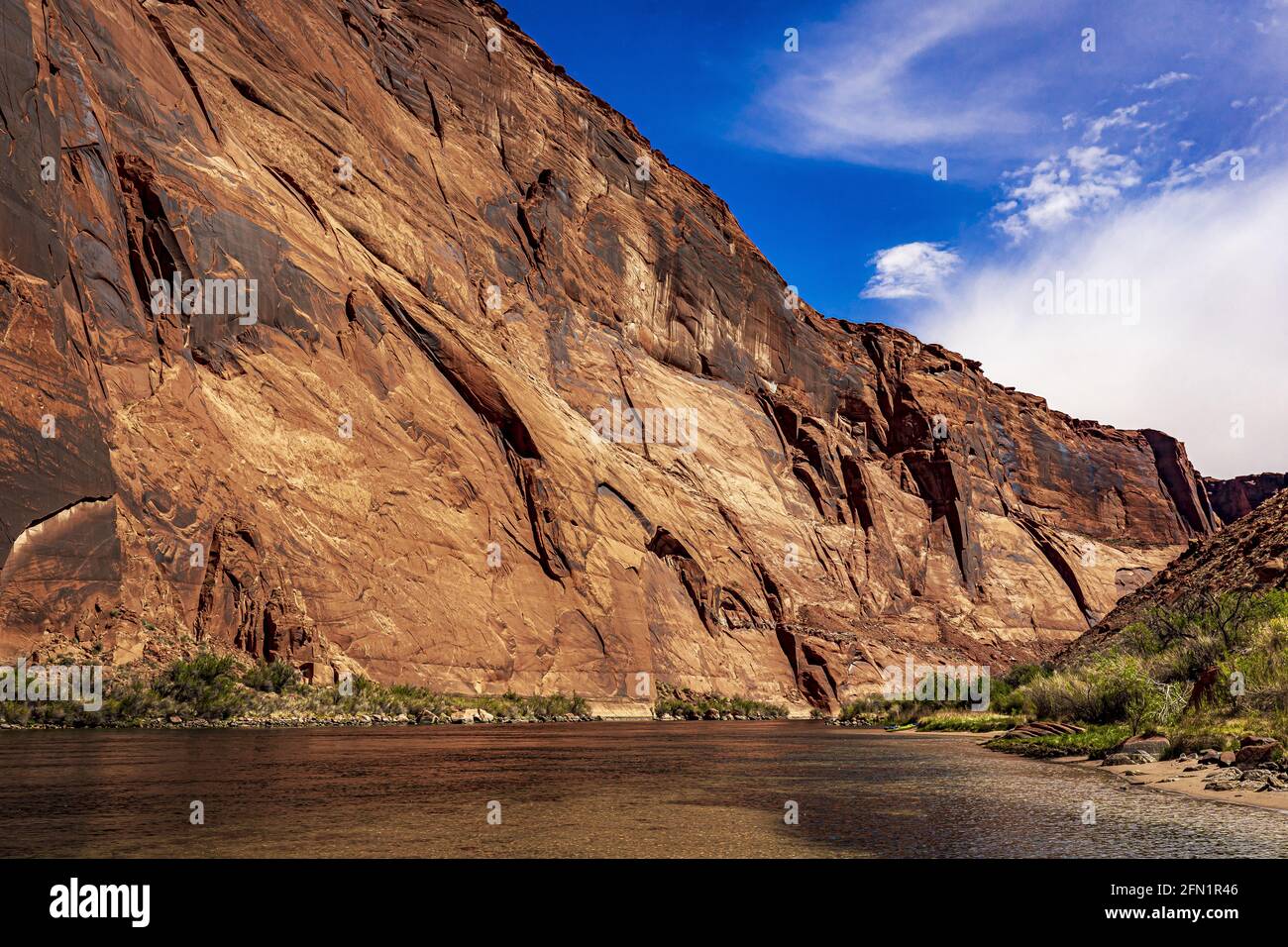 The Colorado River flows by the cliff in the National Recreation Area ...