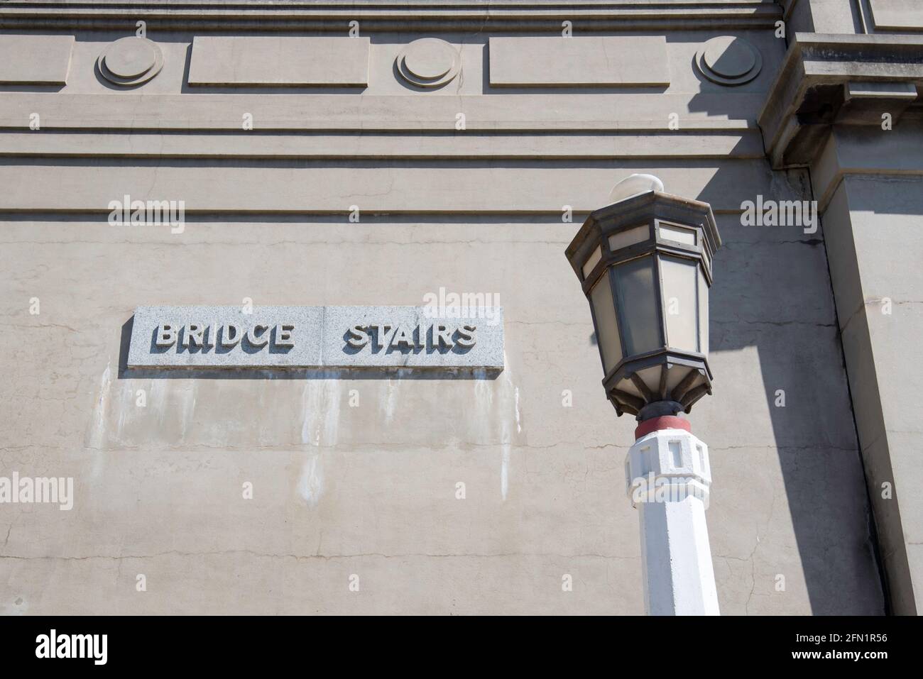 A sign marking the northern approach to the stairs leading up and over ...
