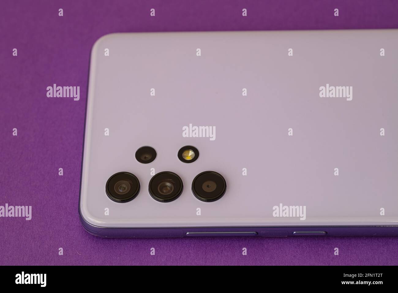 Violet smartphone on purple background for design purpose Stock Photo ...