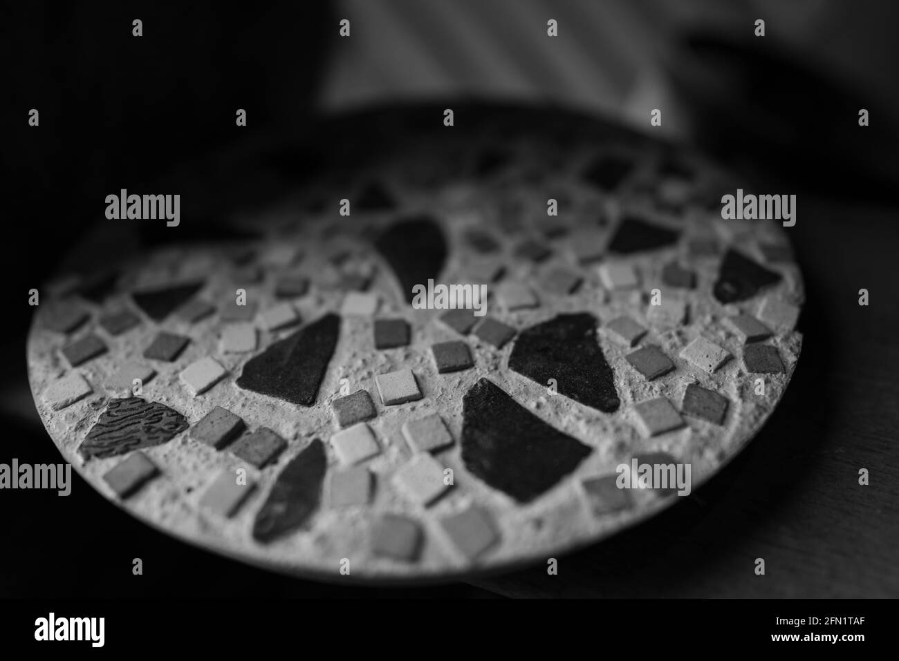 Decorative round stone tile Stock Photo - Alamy