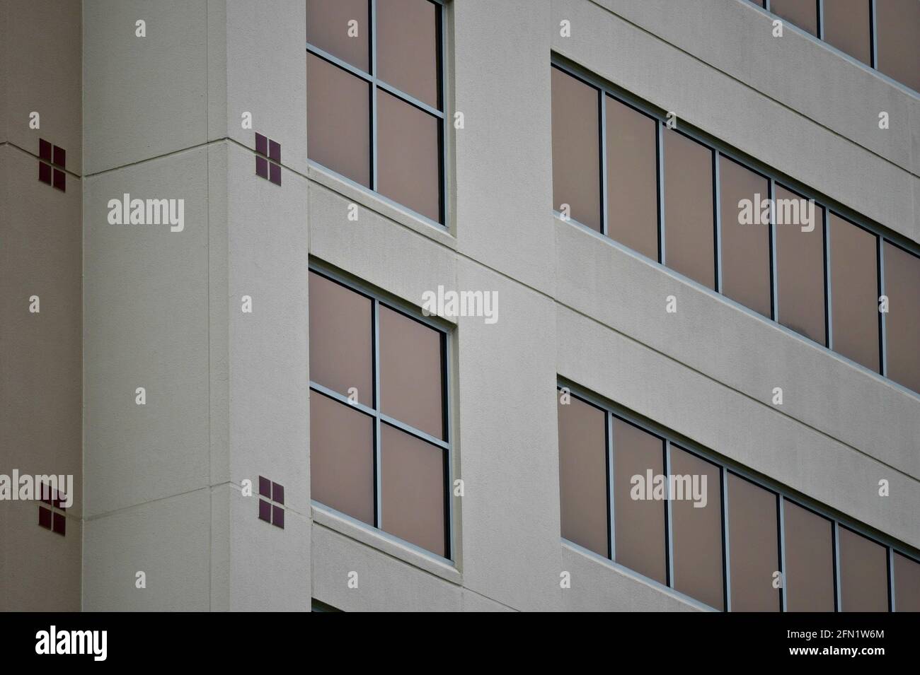 Corporate offices high-rise building concrete and glass facade in ...