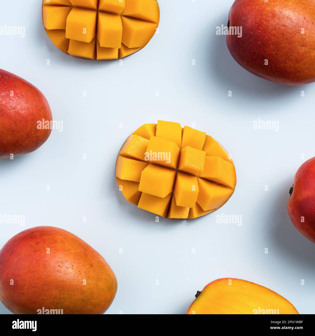 Mango design concept. Top view of diced fresh mango fruit pattern on ...