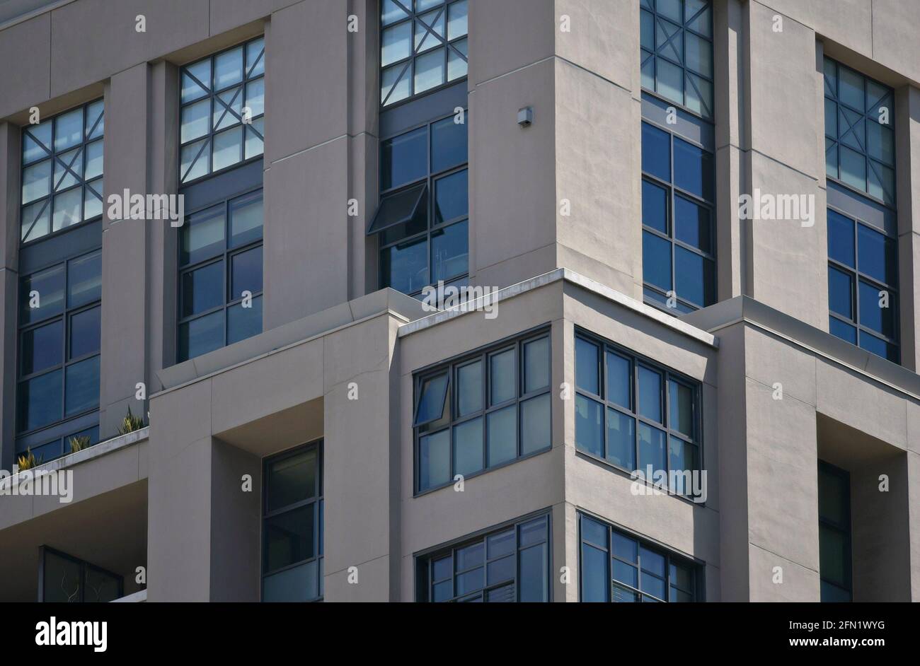 Commercial building concrete and glass facade in downtown San Diego ...
