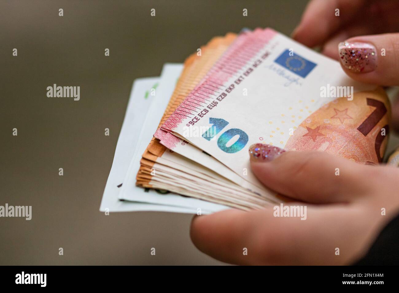 Counting or giving EURO banknotes. World money concept, inflation and ...