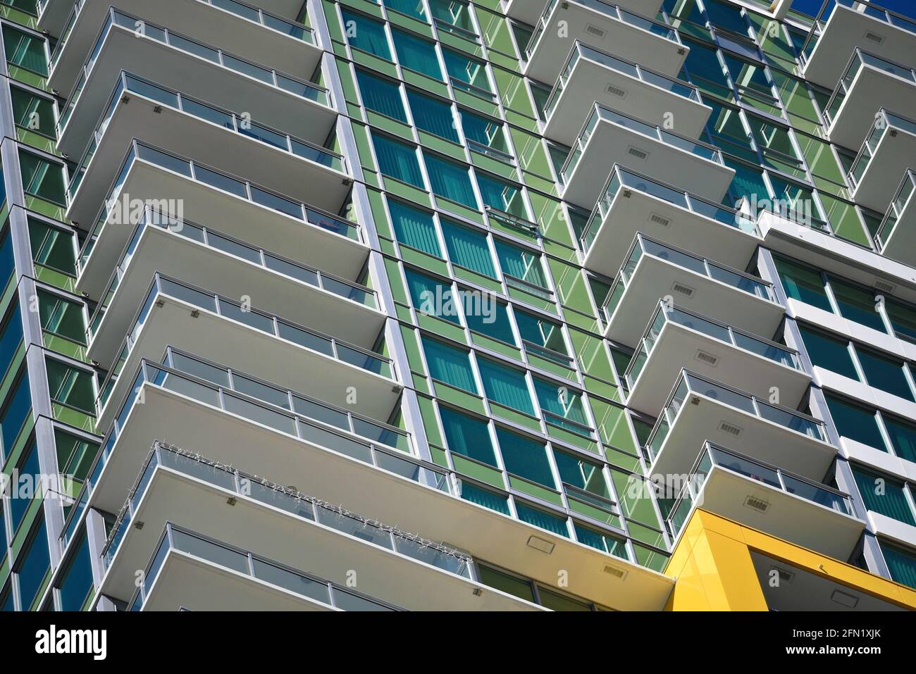 Residential high-rise condominiums complex facade with symmetrical ...