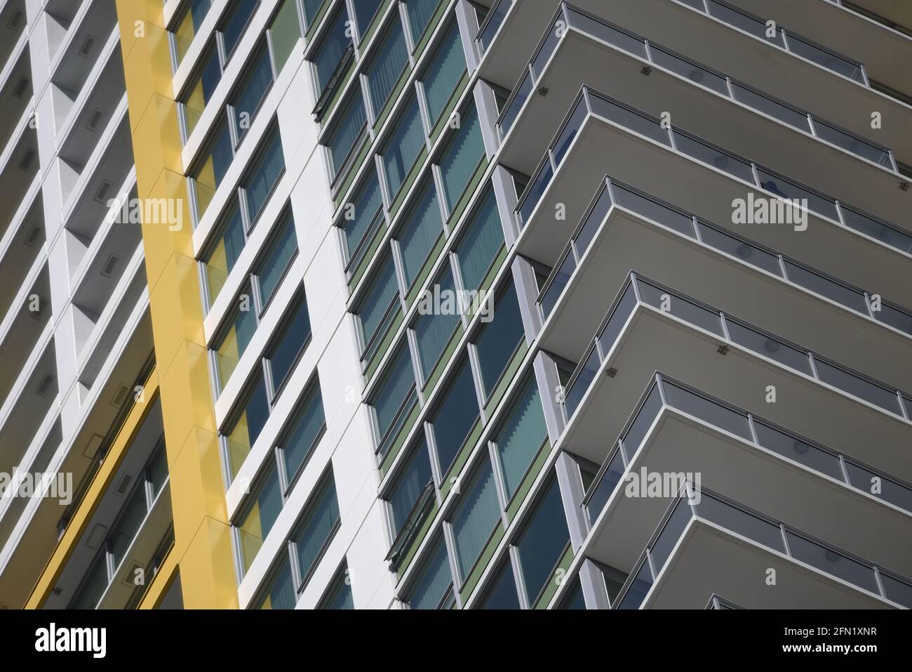 Residential high-rise condominiums complex facade with symmetrical ...