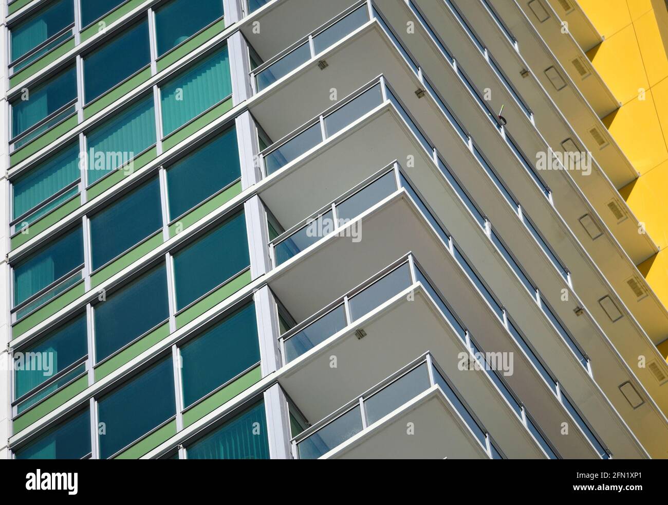 Residential high-rise condominiums complex facade with symmetrical ...