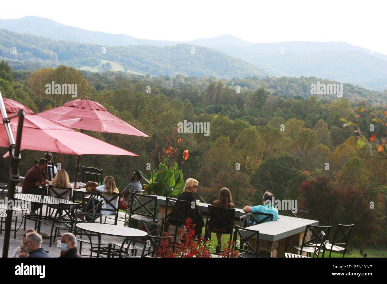 Ragged Branch Distillery, VA, USA. People on the terrace, enjoying the ...