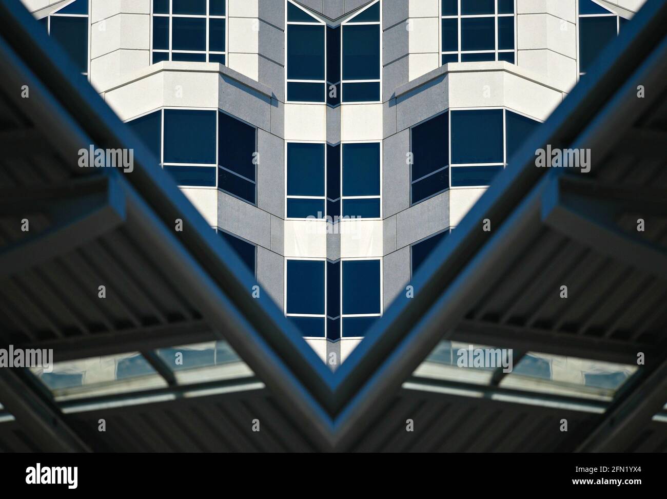 High-rise building facade with symmetrical windows as seen through the ...