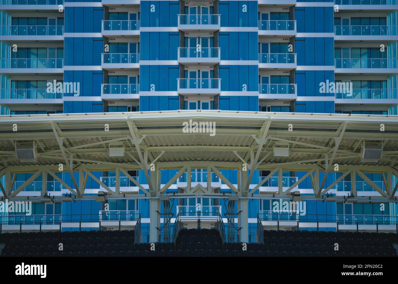 Steel structure stadium canopy with a residential high-rise building in ...