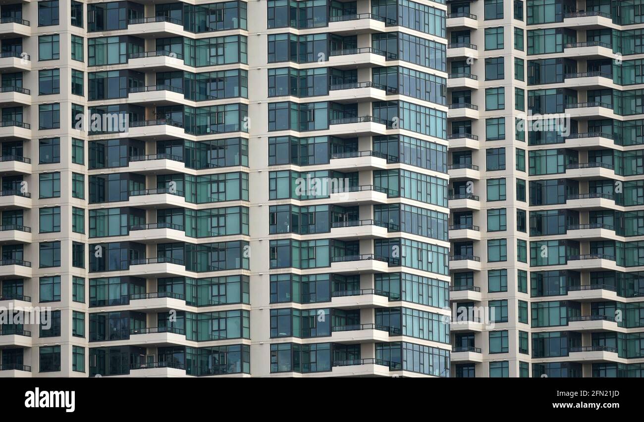 High-rise residential condominiums complex facade with symmetrical ...