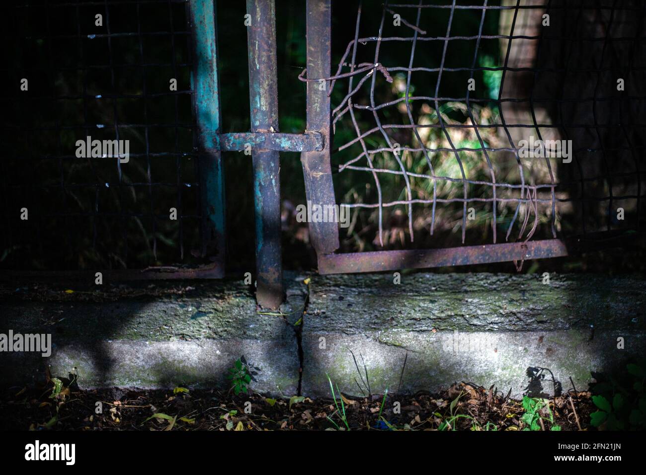Broken iron gate hi-res stock photography and images - Alamy