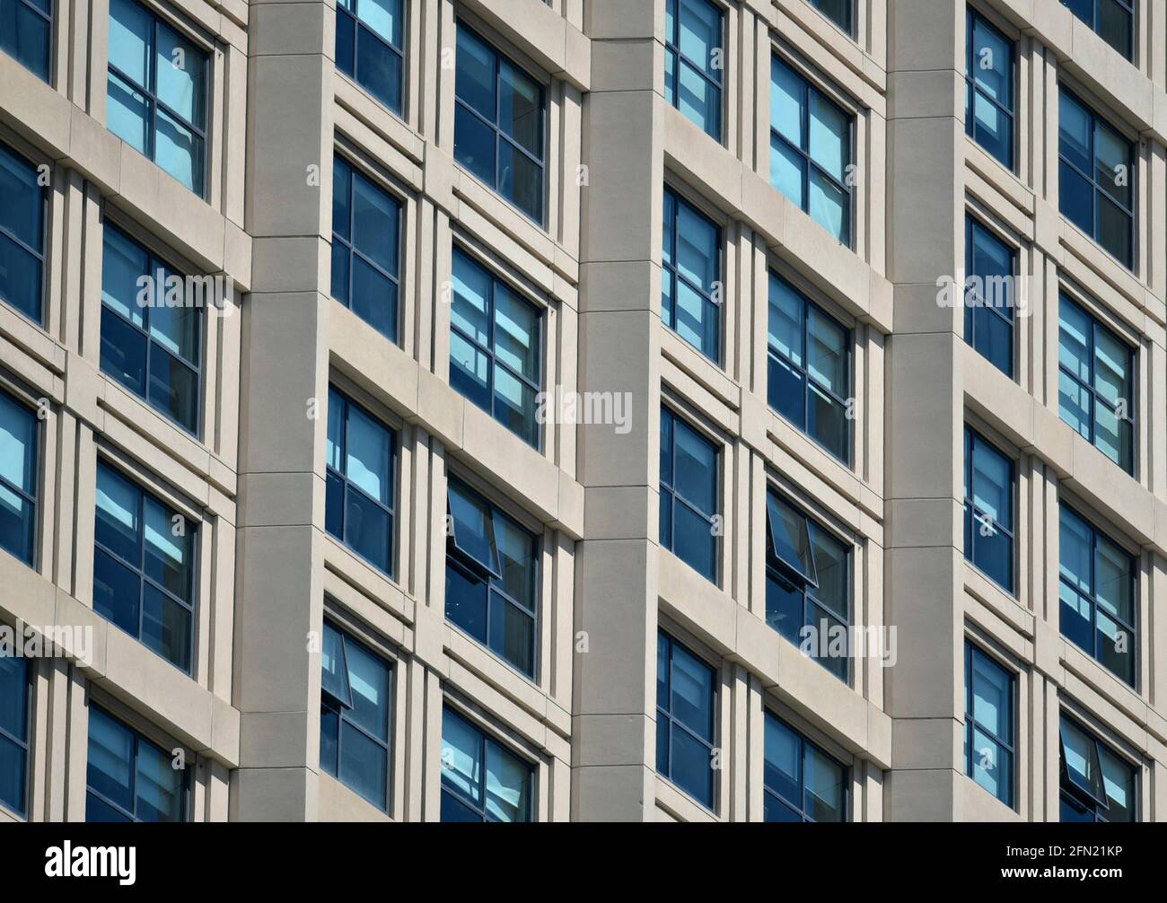 Corporate offices high-rise building concrete and glass facade in San ...