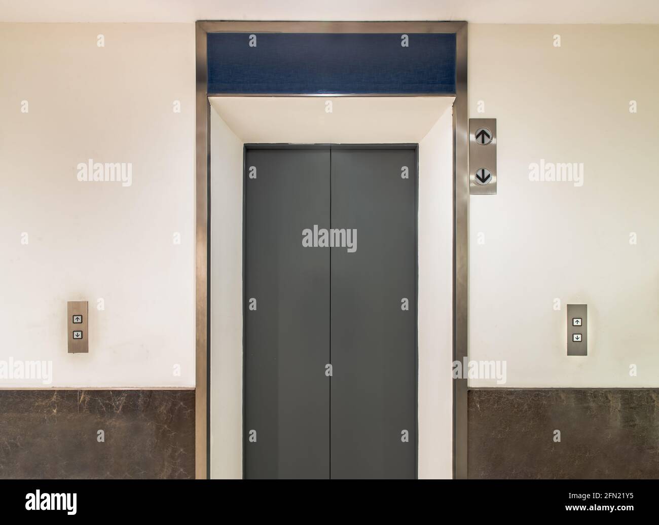 Elevator chrome metal with closed door in condominium. Lift ...
