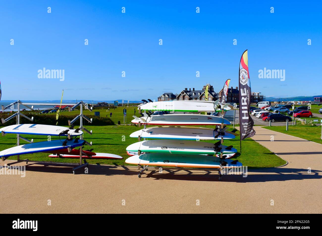 A colourful collection of surf boards outside Porthcawl Surf School at ...