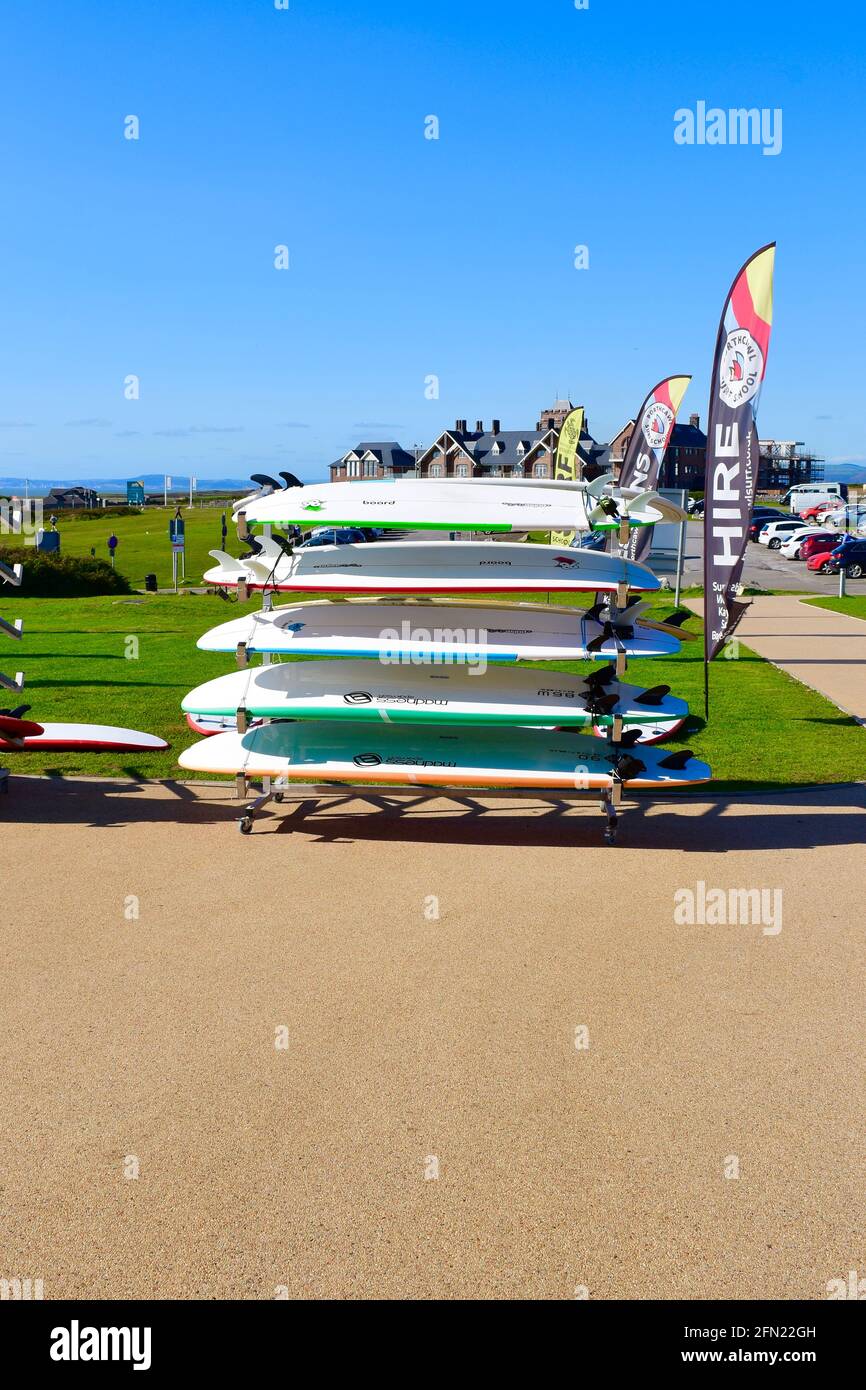 A colourful collection of surf boards outside Porthcawl Surf School at ...