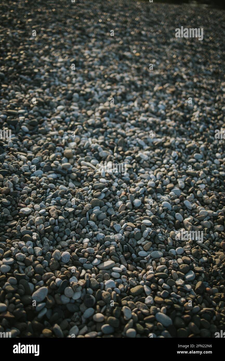 Vertical closeup shot of small gray pebbles Stock Photo - Alamy