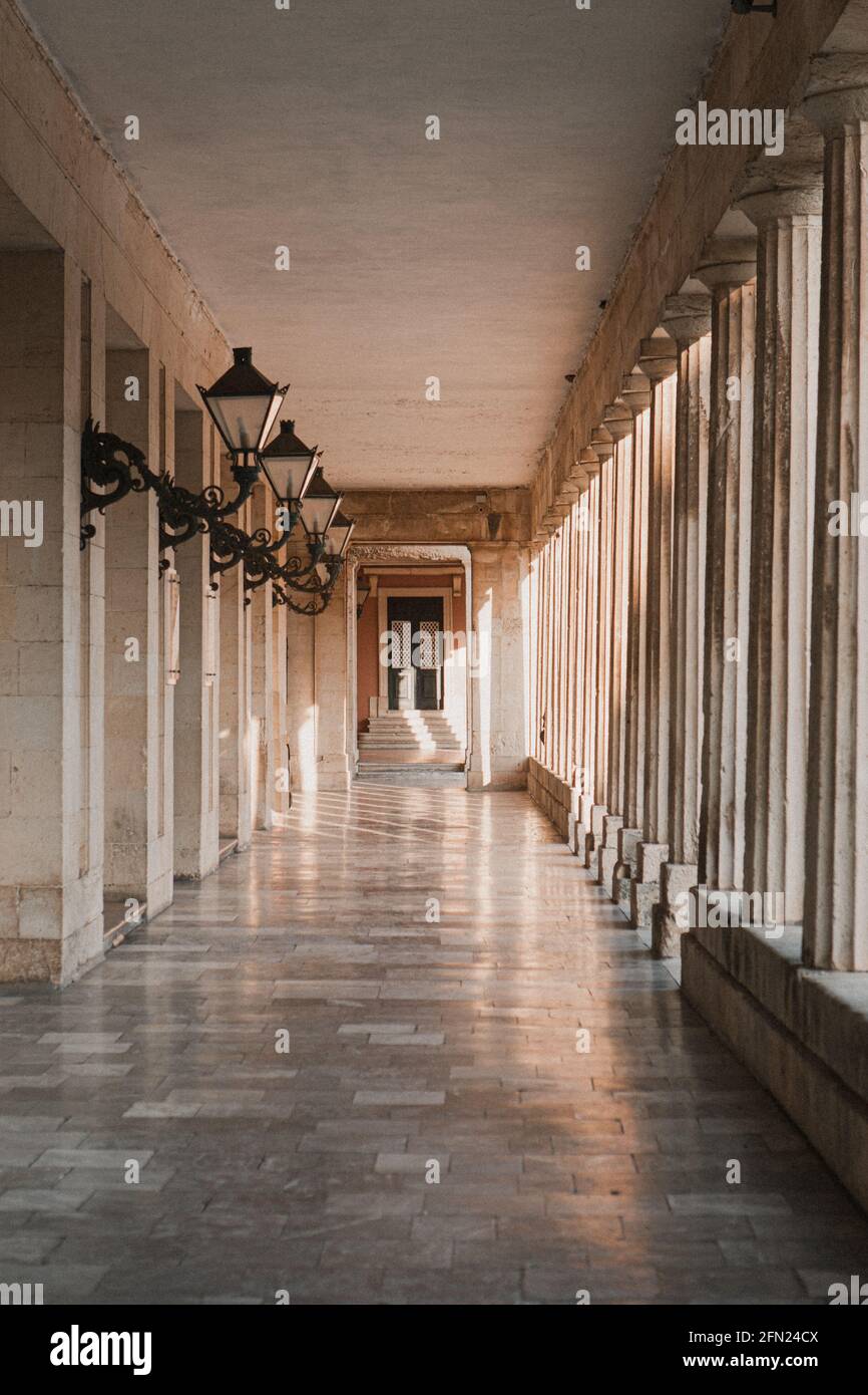 Vertical shot of a corridor with columns Stock Photo - Alamy