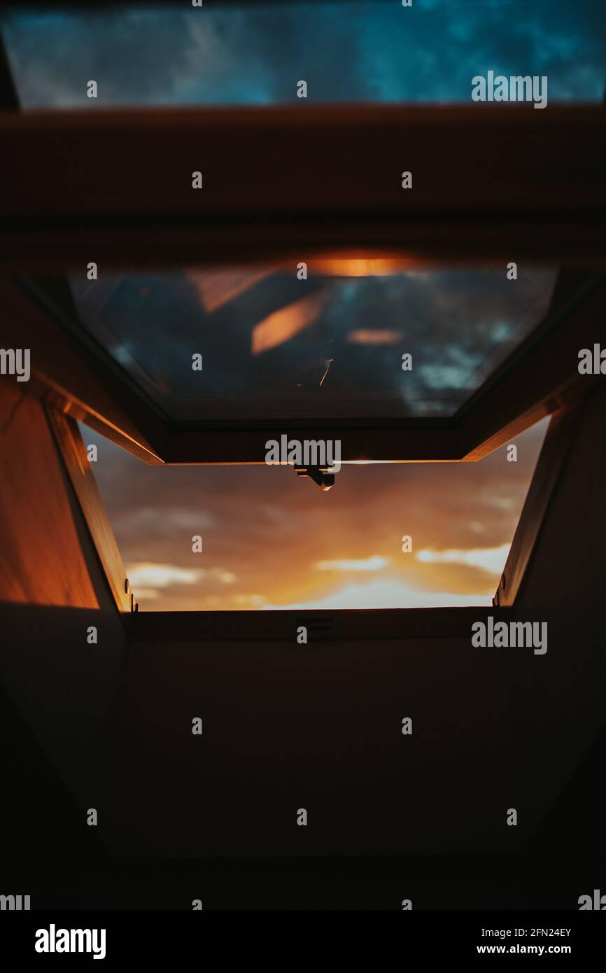 Vertical shot of a beautiful sunset view from a window Stock Photo - Alamy