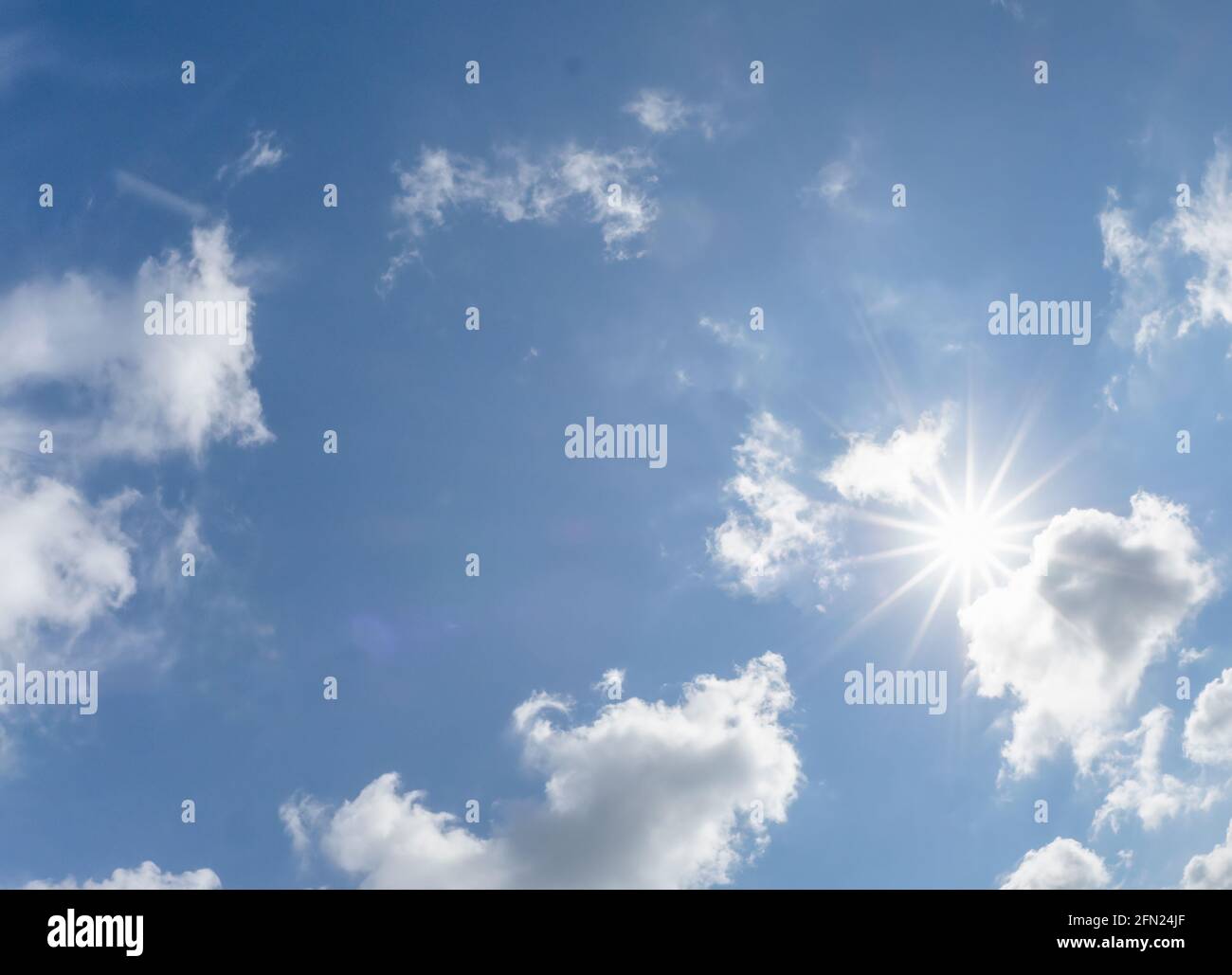 Blue Clouds Sunburst High Resolution Stock Photography and Images - Alamy