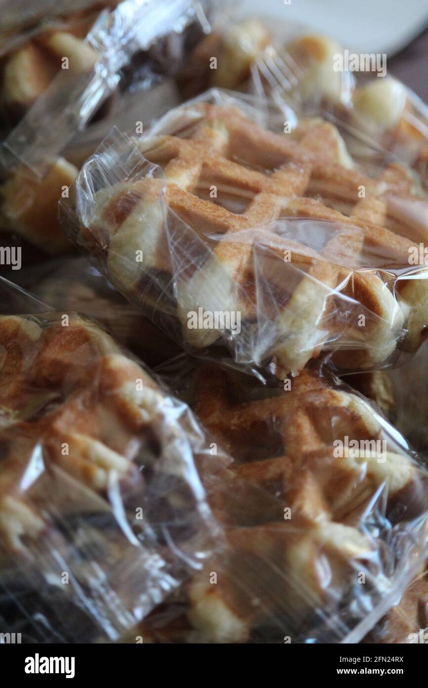 Closeup of small round wafers in plastic packets piled together Stock ...