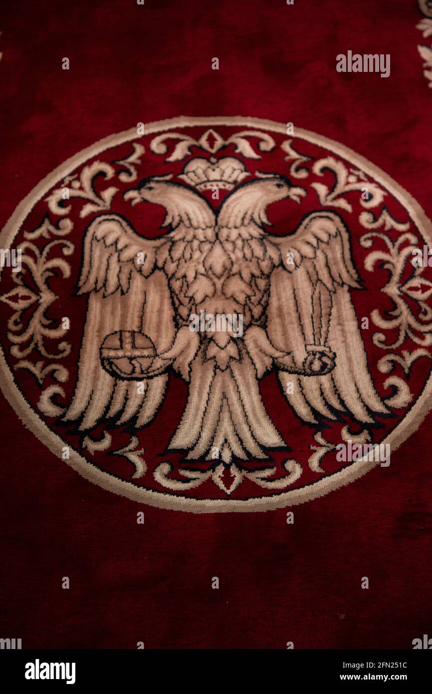 Vertical shot of an eag sign on red cloth Stock Photo - Alamy